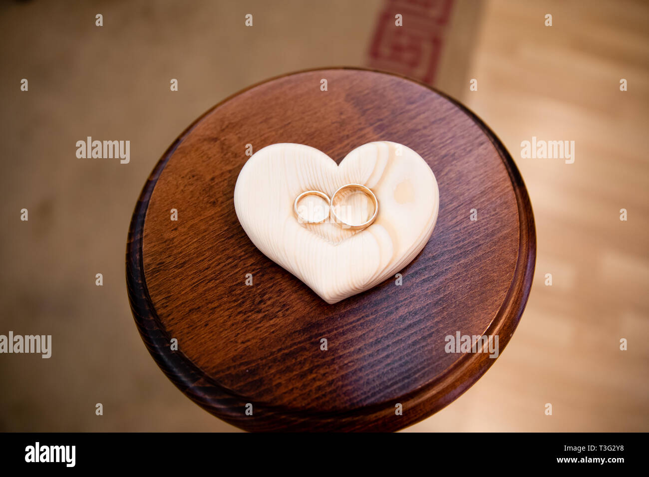Gold wedding rings on stand for rings Stock Photo - Alamy