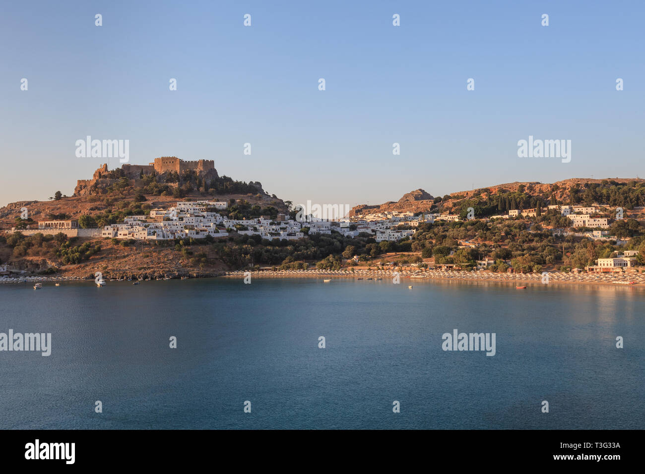 Lindos with the castle above on the Greek Island of Rhodes Stock Photo ...