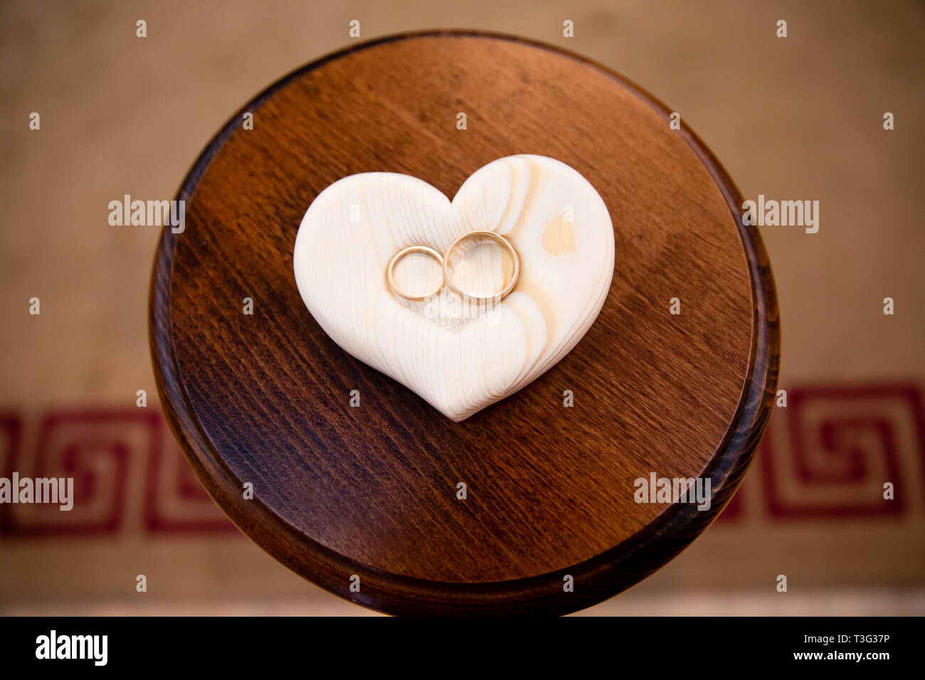 Gold wedding rings on stand for rings Stock Photo - Alamy