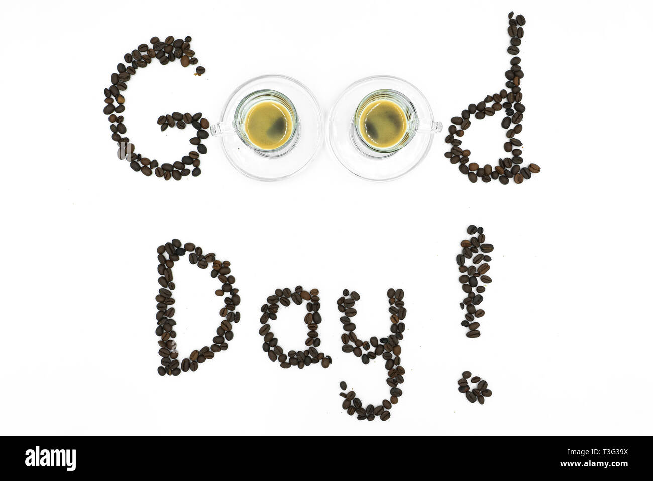 "Good Day" written with coffee beans and 2 espressos on a white ...