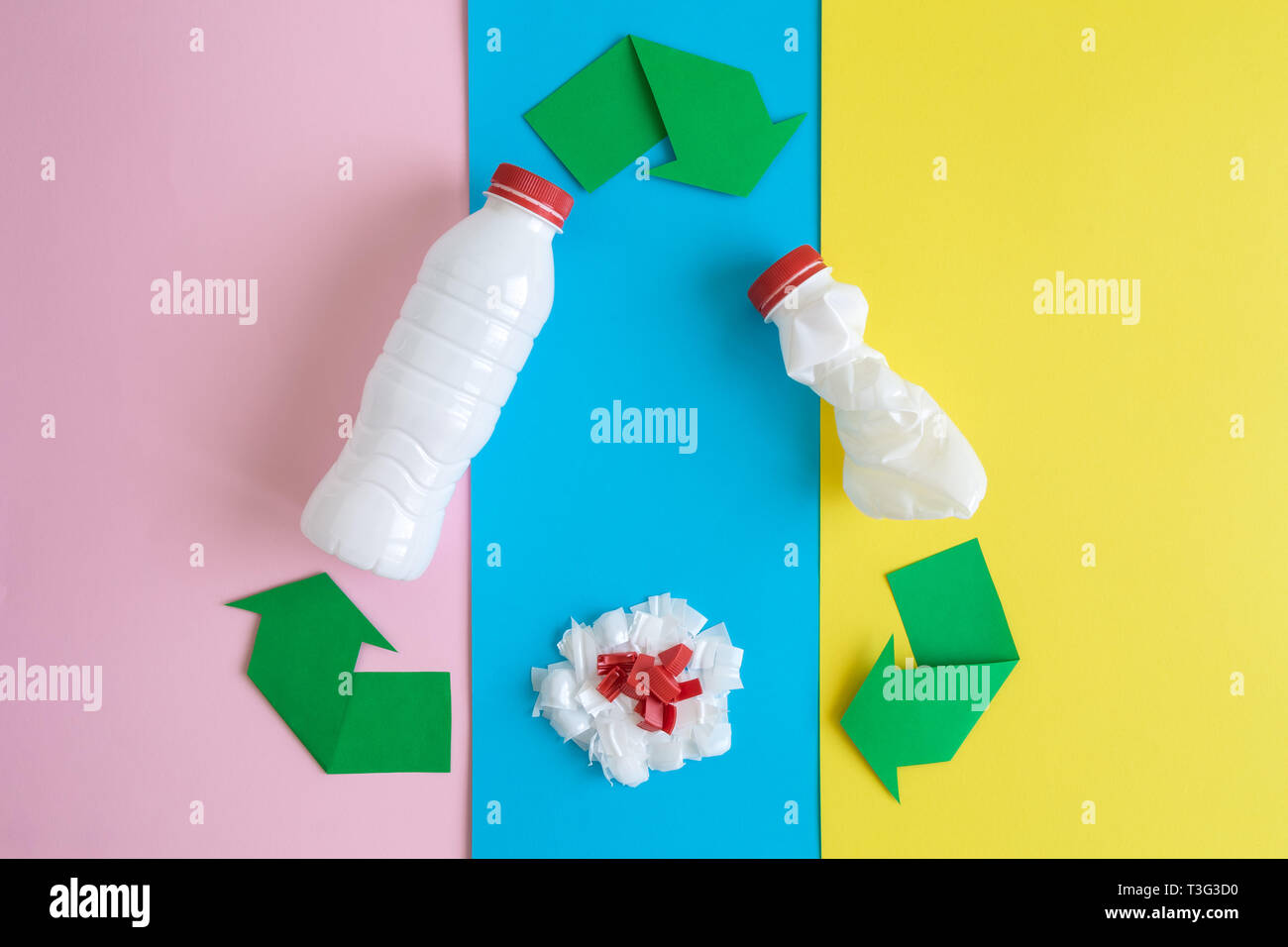 Recycle sign with plastic bottles isolated over pastel background ...