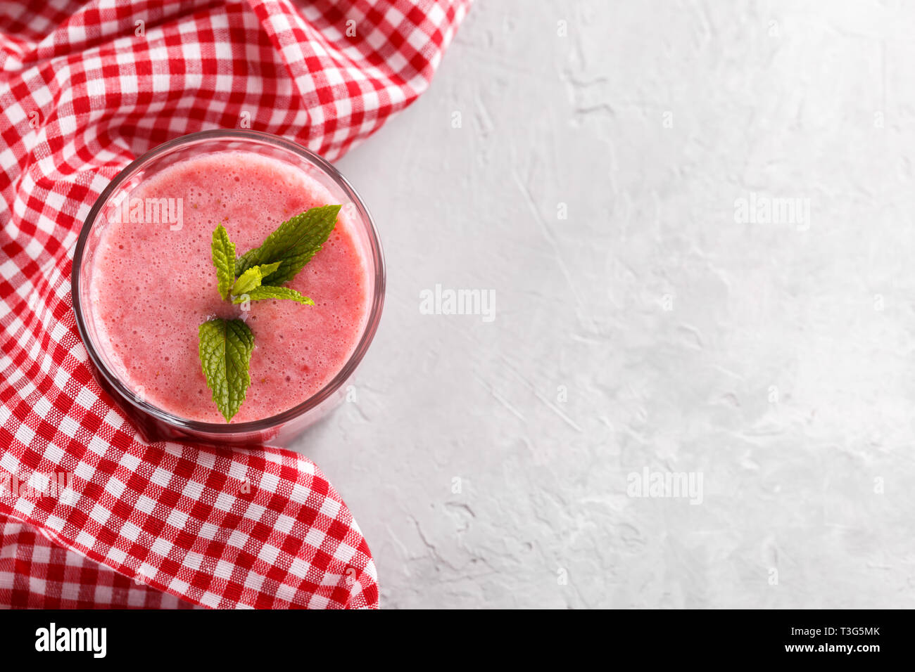 Strawberry milkshake or smoothie in a glass, top view copy space Stock ...