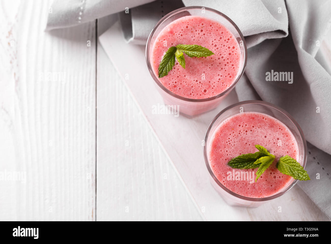 Strawberry milkshake or smoothie in a glass, top view copy space Stock ...