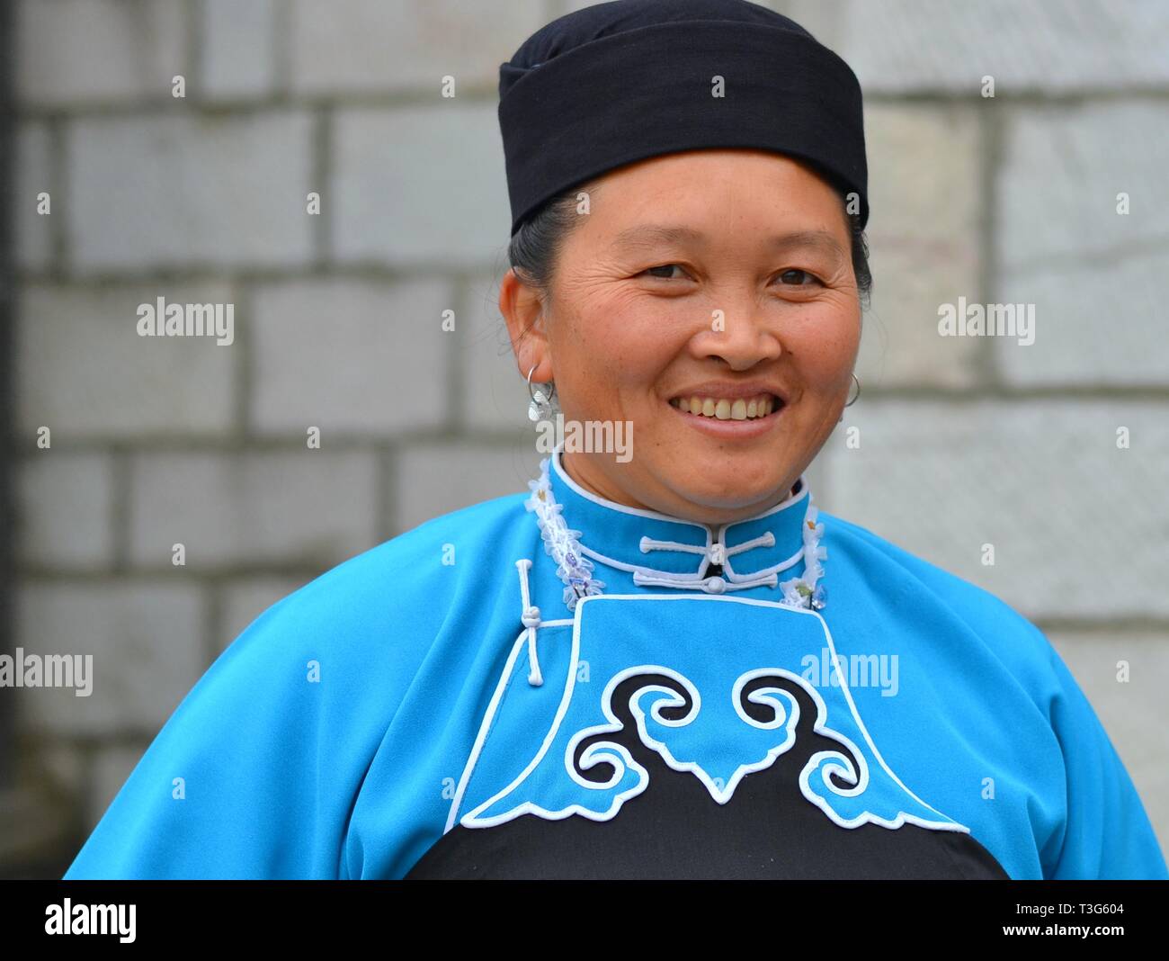 Young Zhuang woman (Chinese ethnic minority) wears her black-and-blue ...