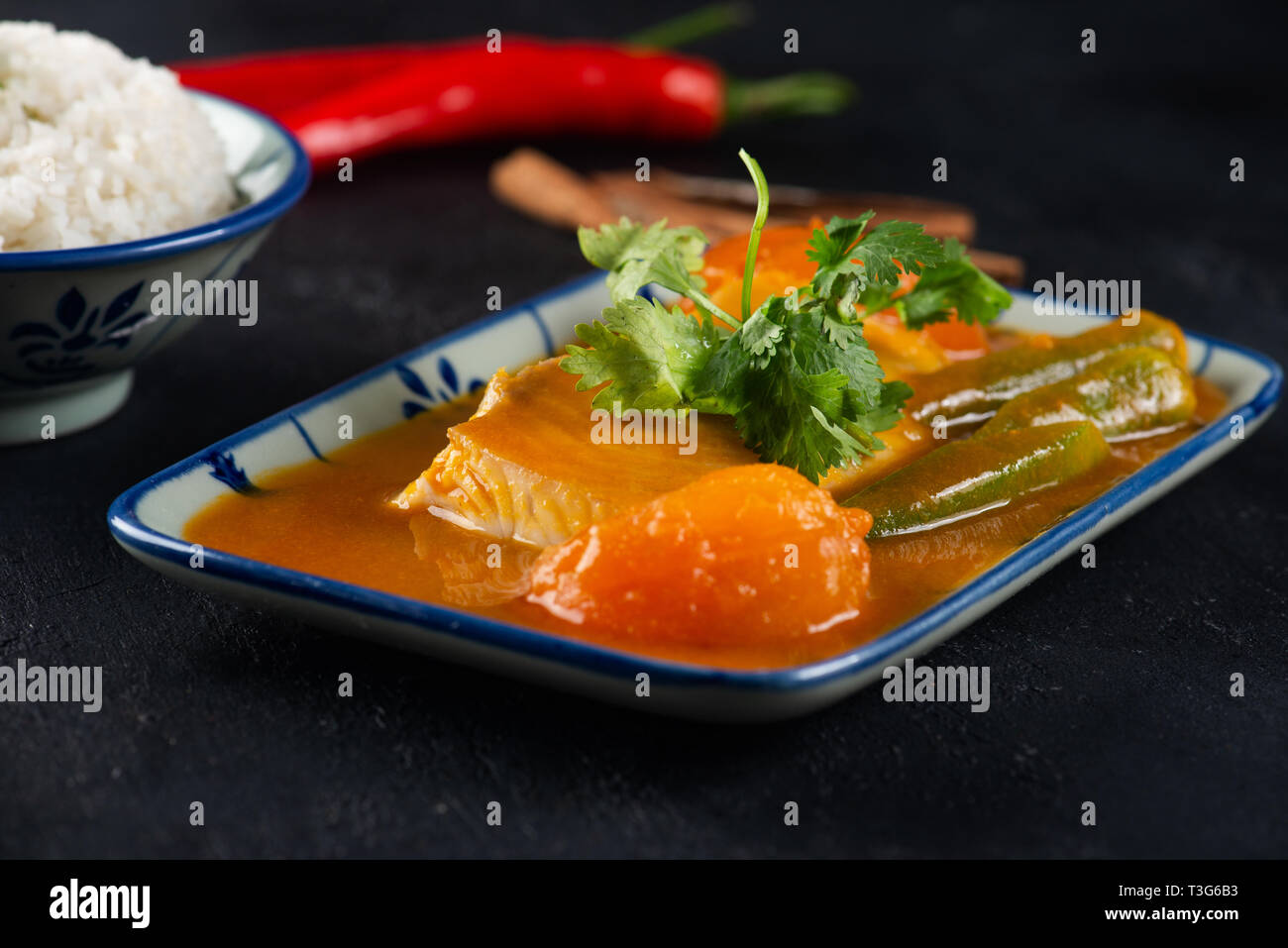 asam curry fish with rice Stock Photo - Alamy