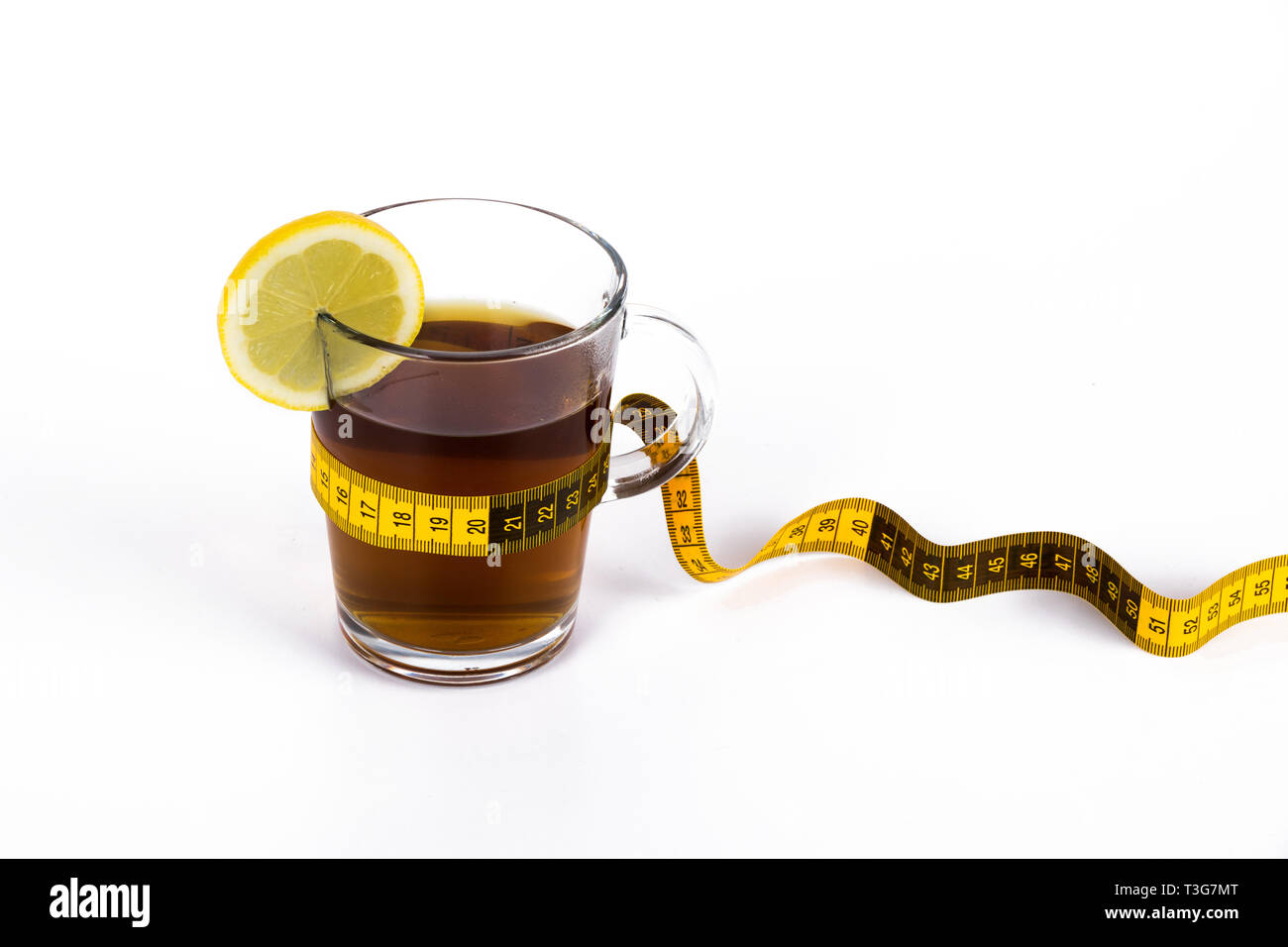 Slimming tea, cup with tea with lemon and measuring tape isolated on ...