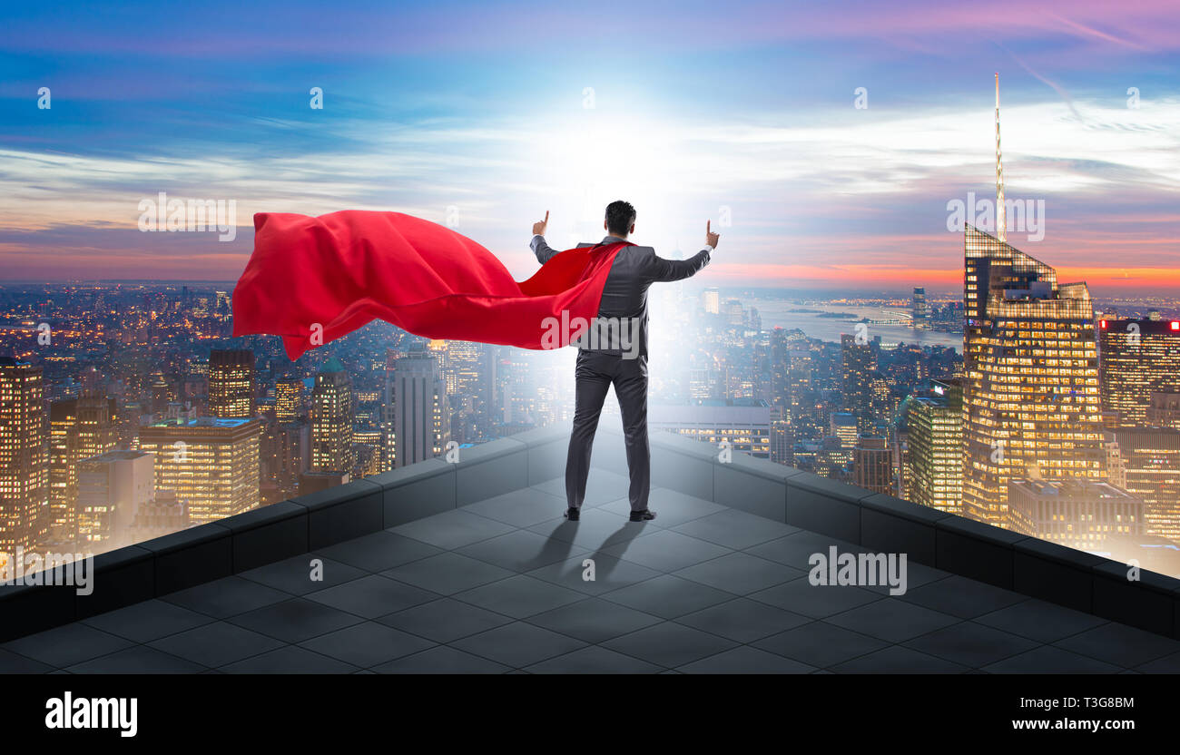 Superhero businessman on top of building Stock Photo - Alamy