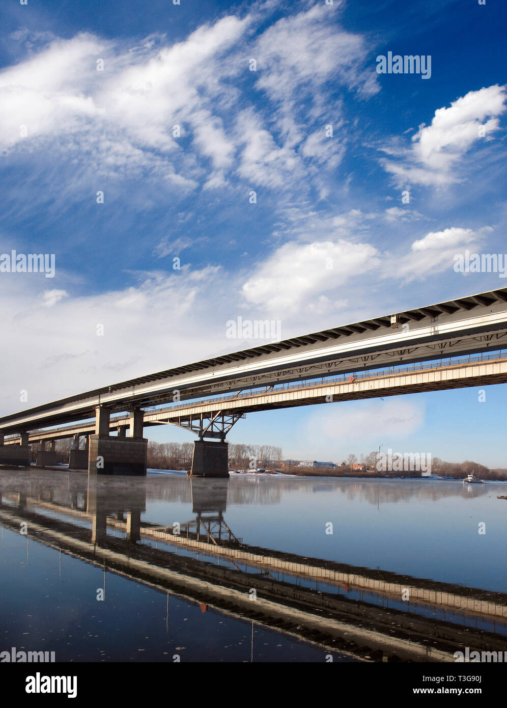 Bridge over river. Blue sky and white clouds Stock Photo - Alamy