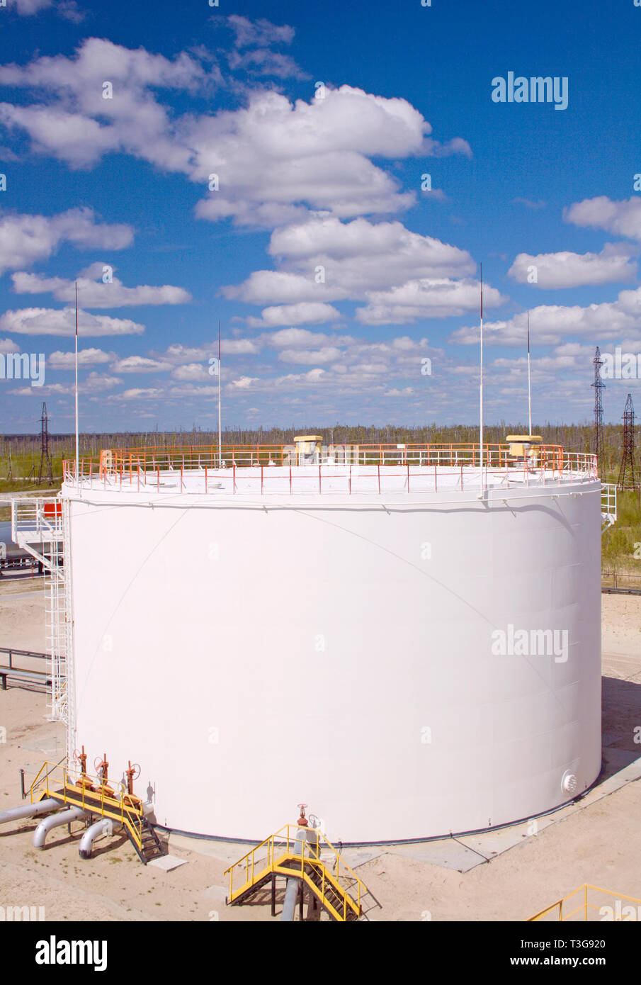White oil reservoir. Oil and gas refinery plant. Industrial scene of ...