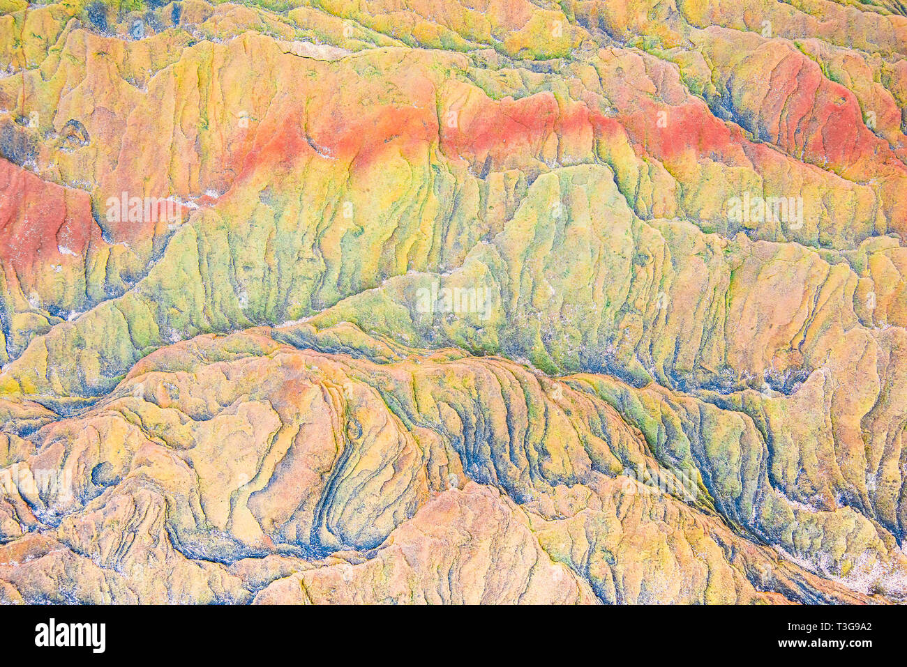 Colourful mosaics or rocks - layered sedimentary minerals exposed by ...