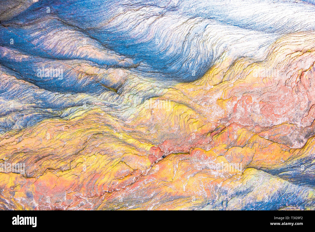 Colourful mosaics or rocks - layered sedimentary minerals exposed by ...