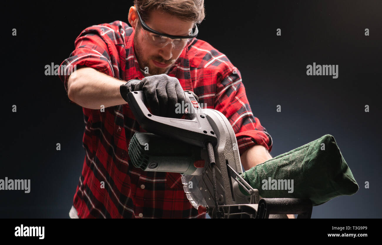 Man using miter saw to cut wood hi-res stock photography and images - Alamy