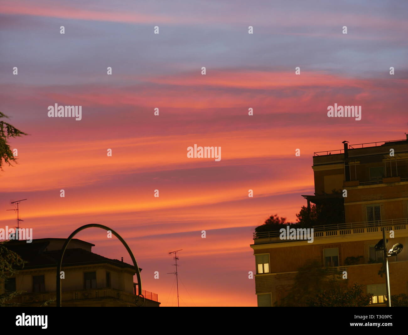 Sunset with buildings in Italy Stock Photo - Alamy