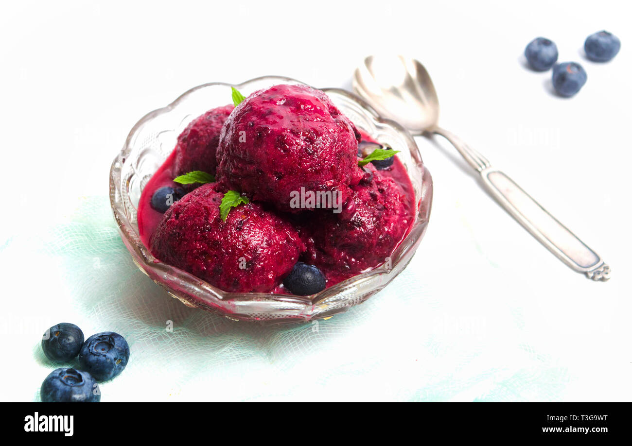 Blueberry fruit ice cream in a cup isolated on white Stock Photo - Alamy