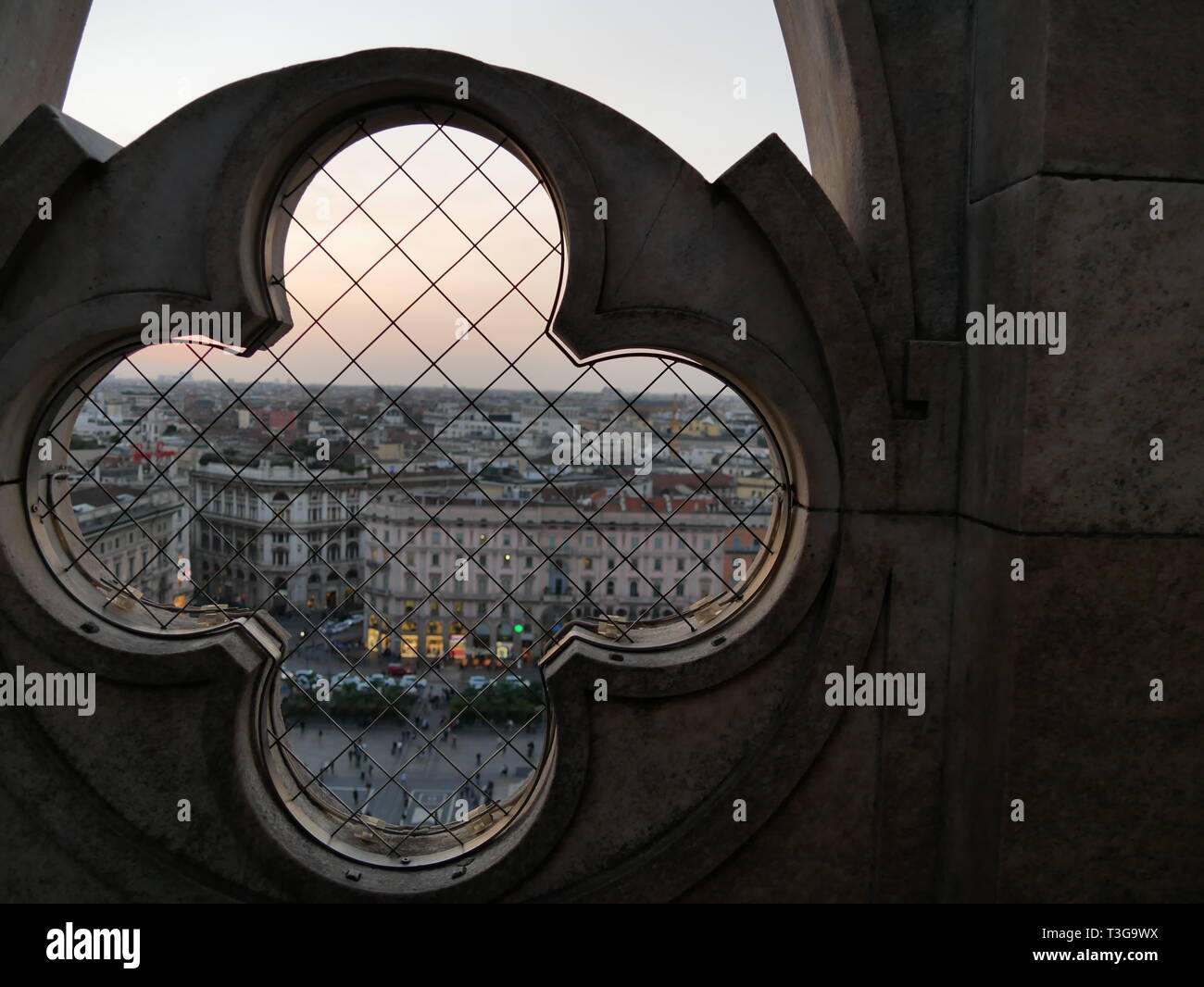 Window to public square with fence Stock Photo - Alamy