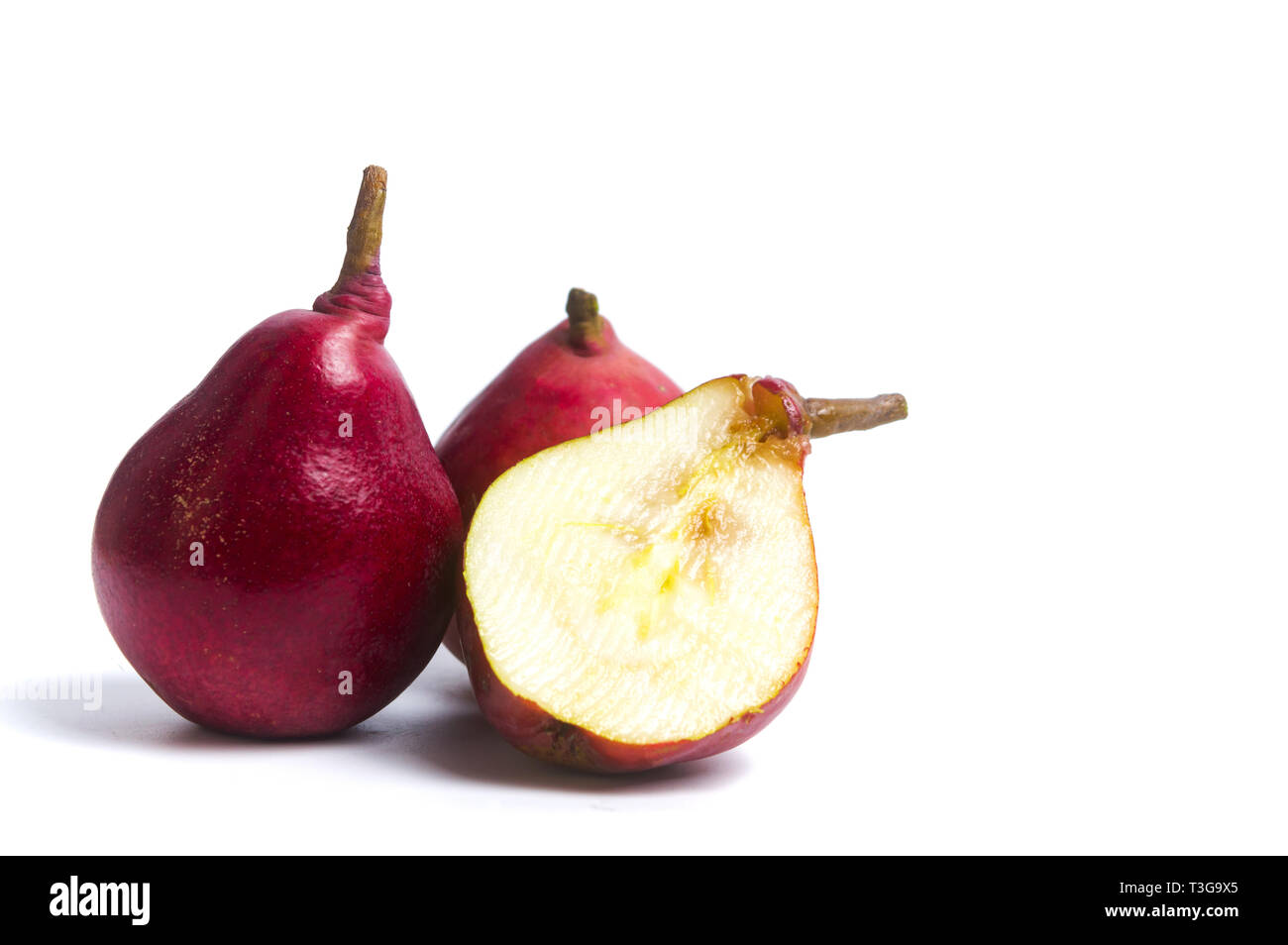 Red pear fruits isolated on white background Stock Photo - Alamy