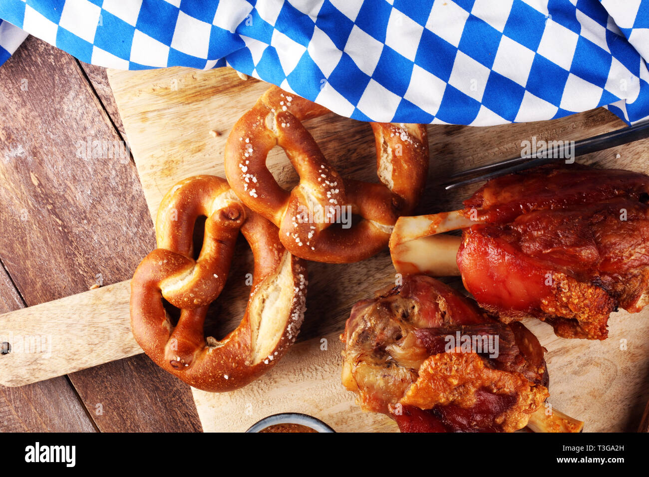 Traditional German cuisine, Schweinshaxe roasted ham hock. pretzels ...