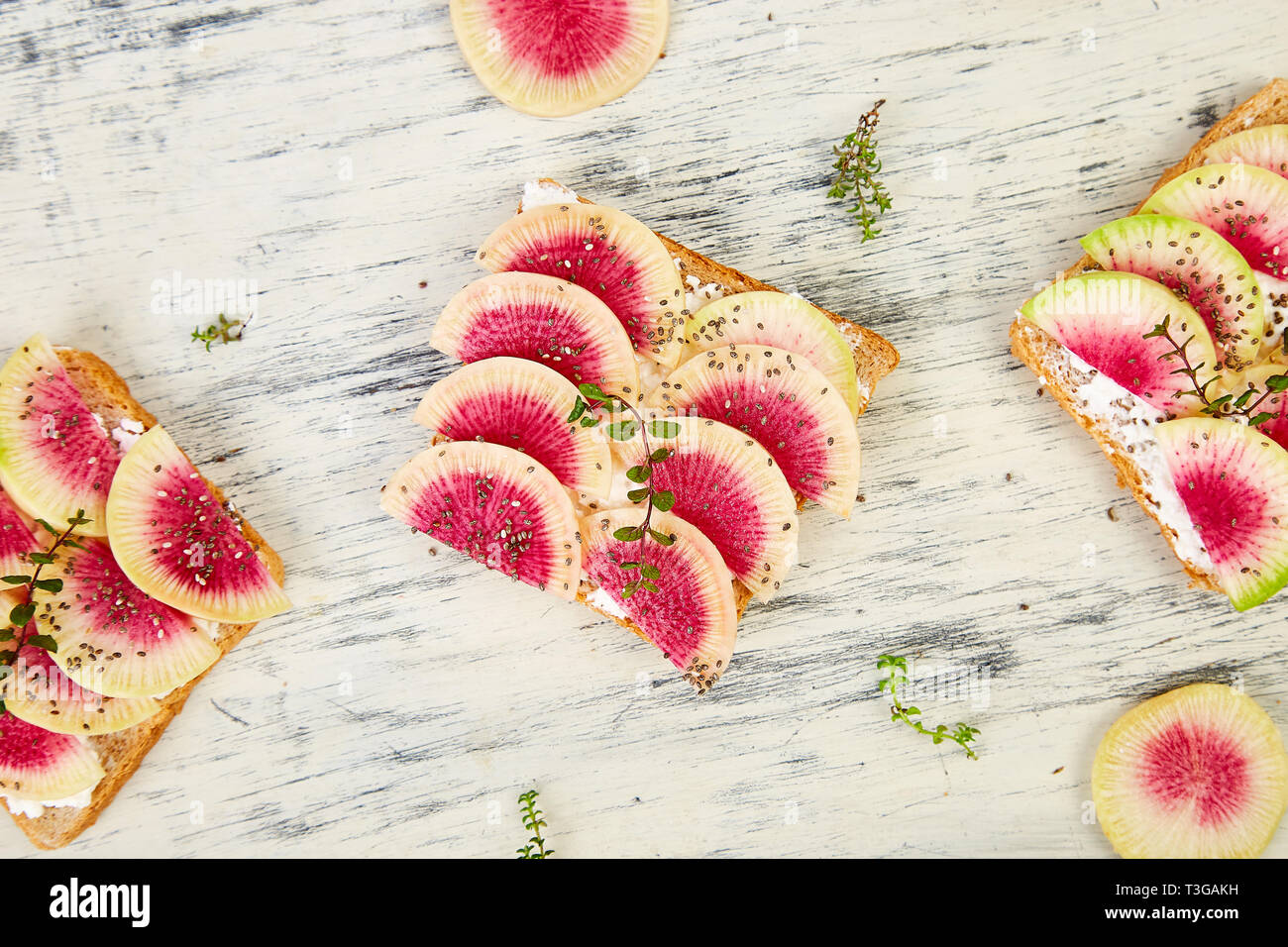 Healthy breakfast toasts from sliced watermelon radish or chinese ...