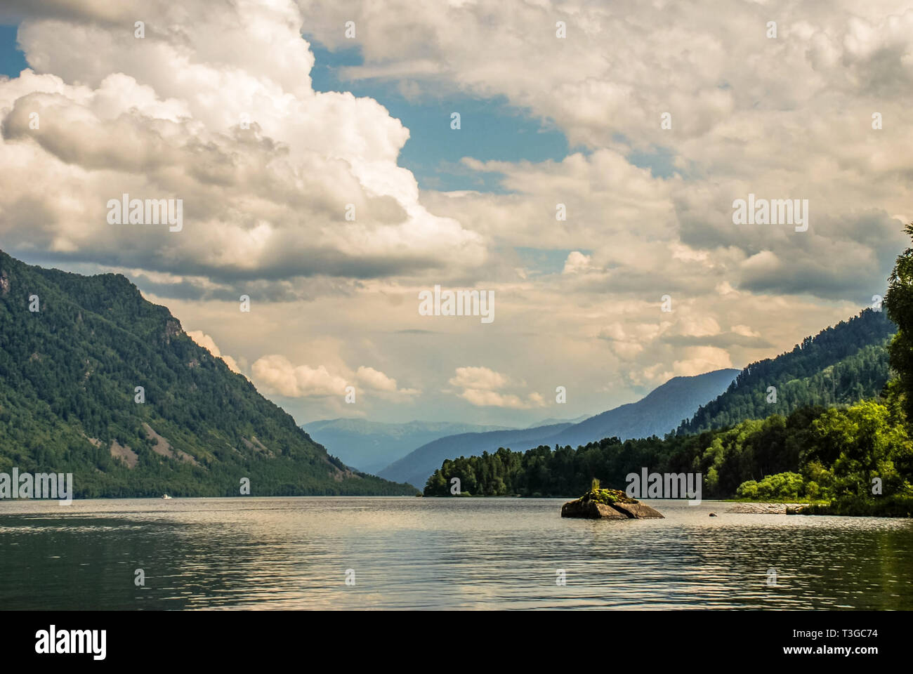 Landscape with mountains, forest and a river Stock Photo - Alamy