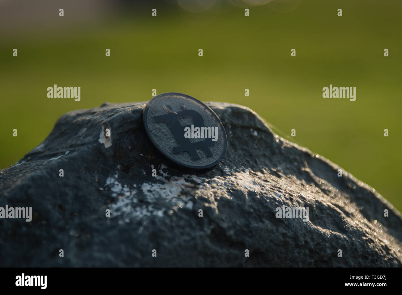 Made from black plastic custom bit coin on rustic old background Stock ...