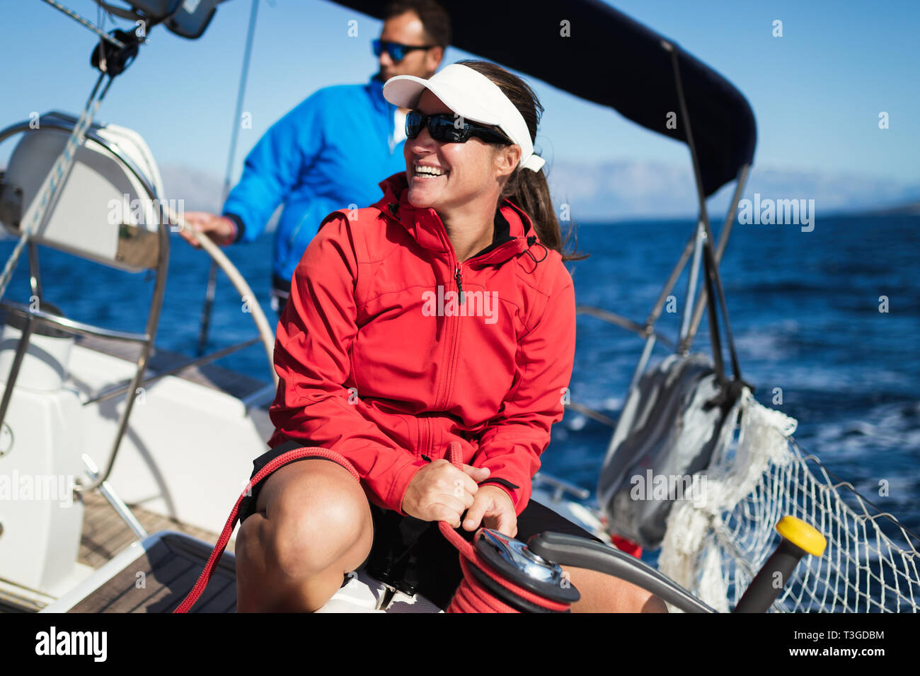Attractive strong woman sailing with her boat Stock Photo - Alamy