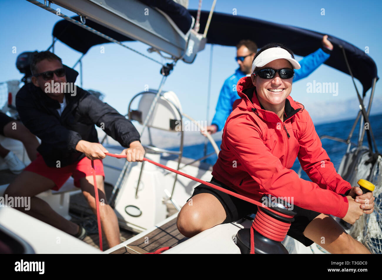 Attractive strong woman sailing with her boat Stock Photo - Alamy