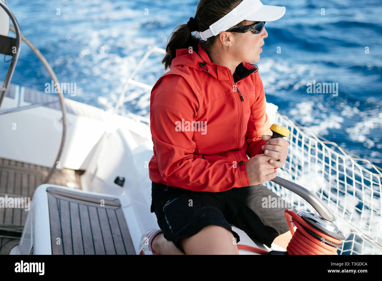Attractive strong woman sailing with her boat Stock Photo - Alamy