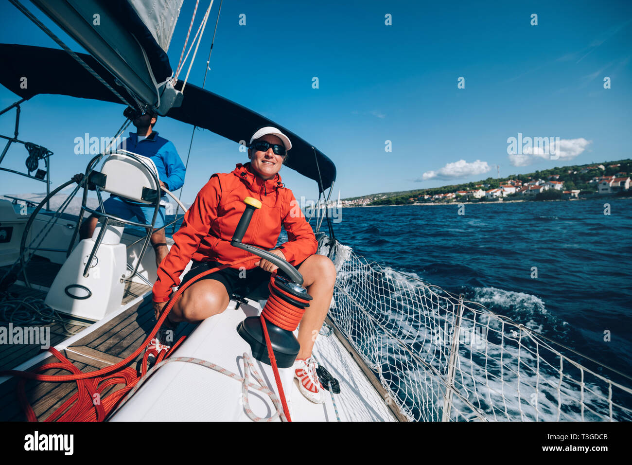 Attractive strong woman sailing with her boat Stock Photo - Alamy