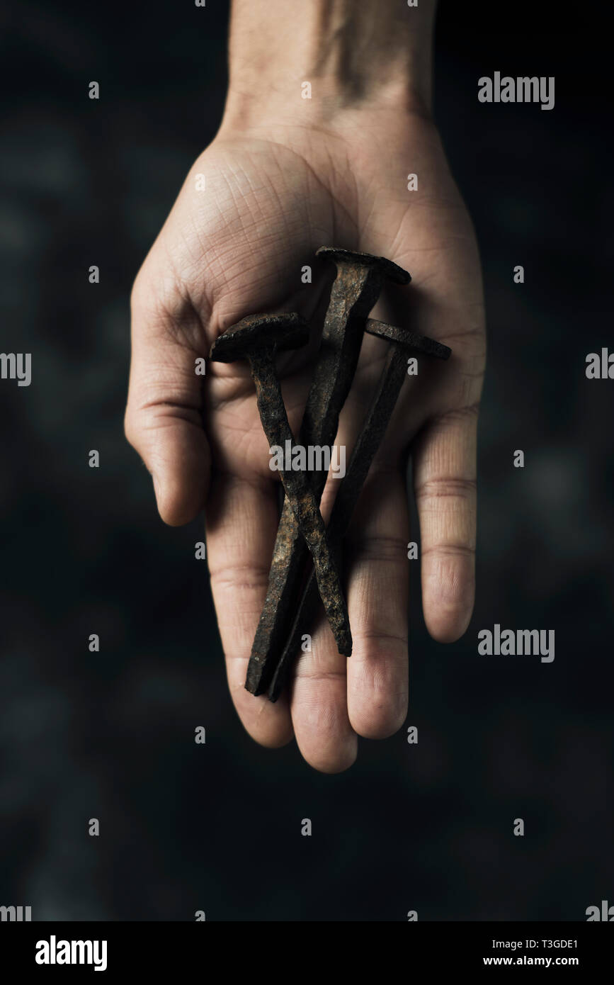 high angle view of three rusty nails, depicting the holy nails of the ...
