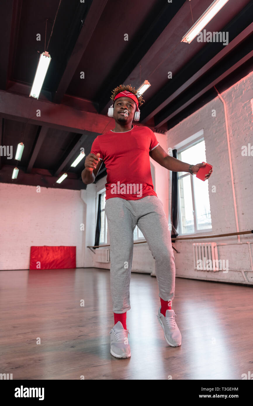 Focused dark-skinned professional dancer learning choreography Stock ...