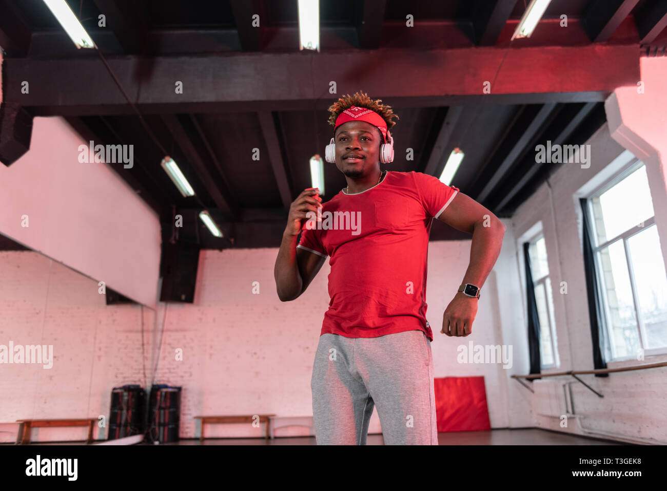 Flexible good-looking guy working hard in dancing studio Stock Photo ...