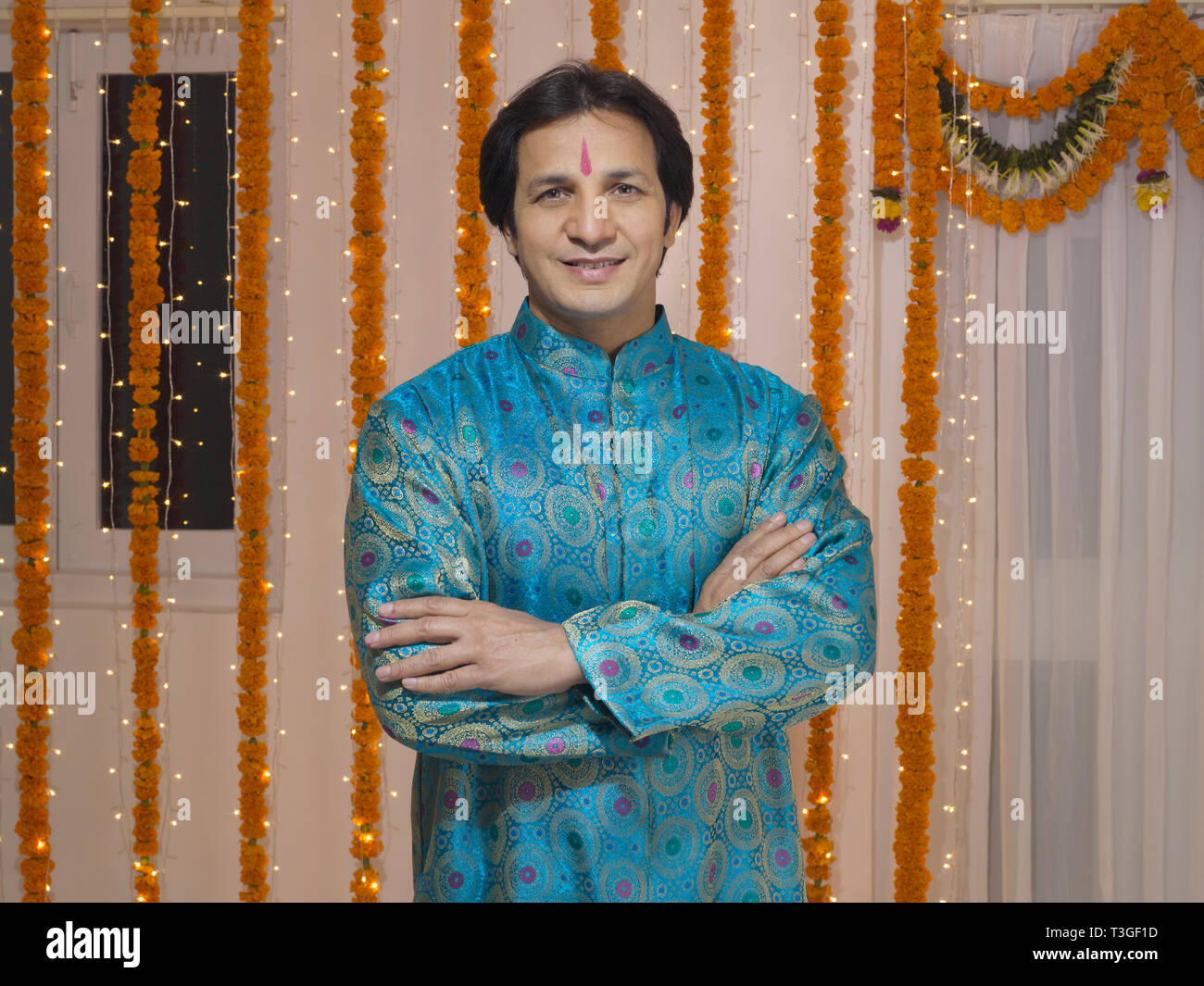 PORTRAIT OF AN INDIAN MAN CELEBRATING THE FESTIVAL OF DIWALI IN HIS ...