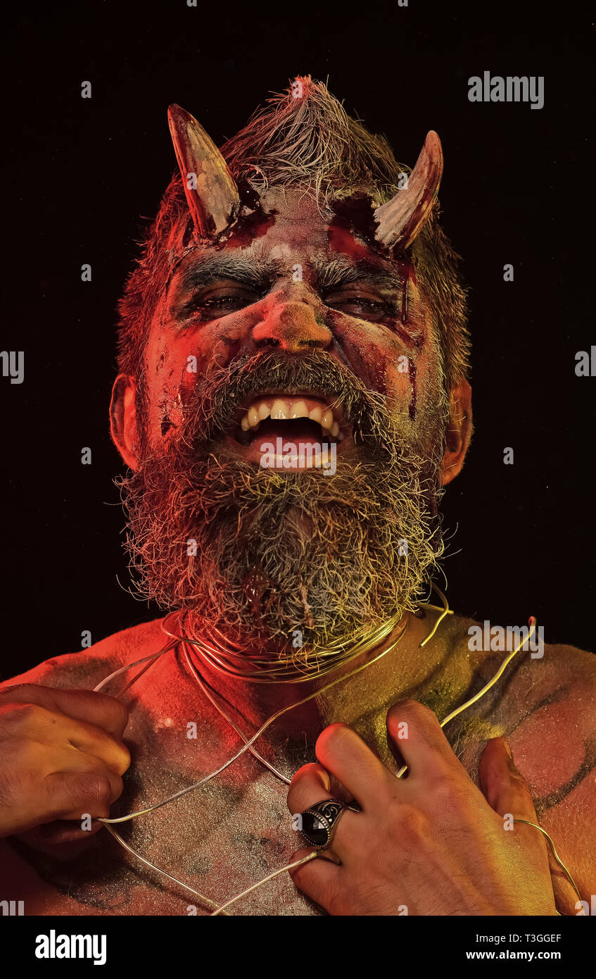 Halloween man demon roar on black background Stock Photo - Alamy