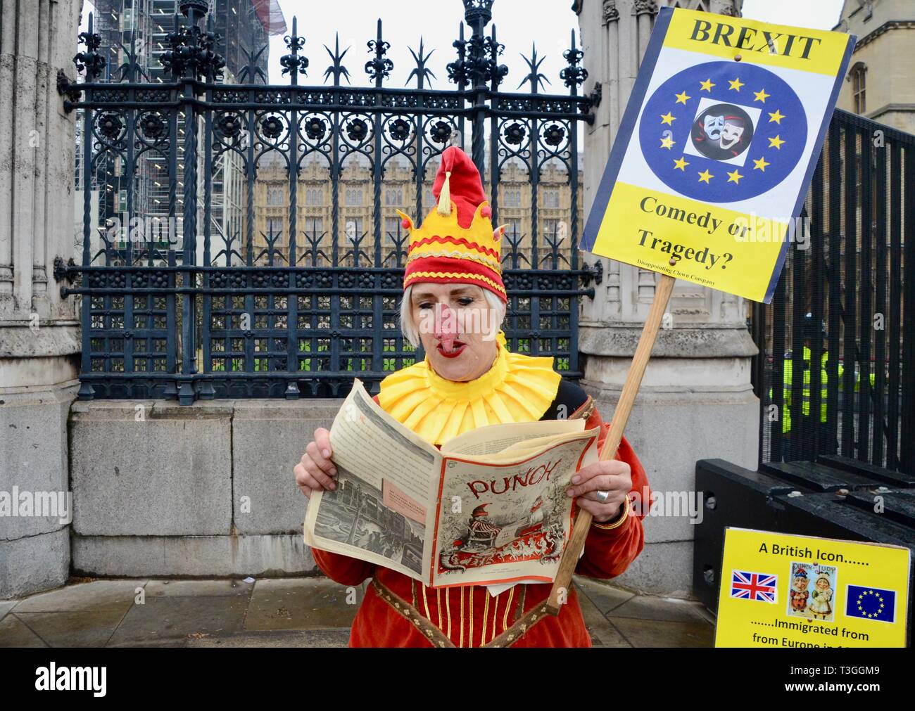 a lone woman protester in punch and judy costume outside parliament ...