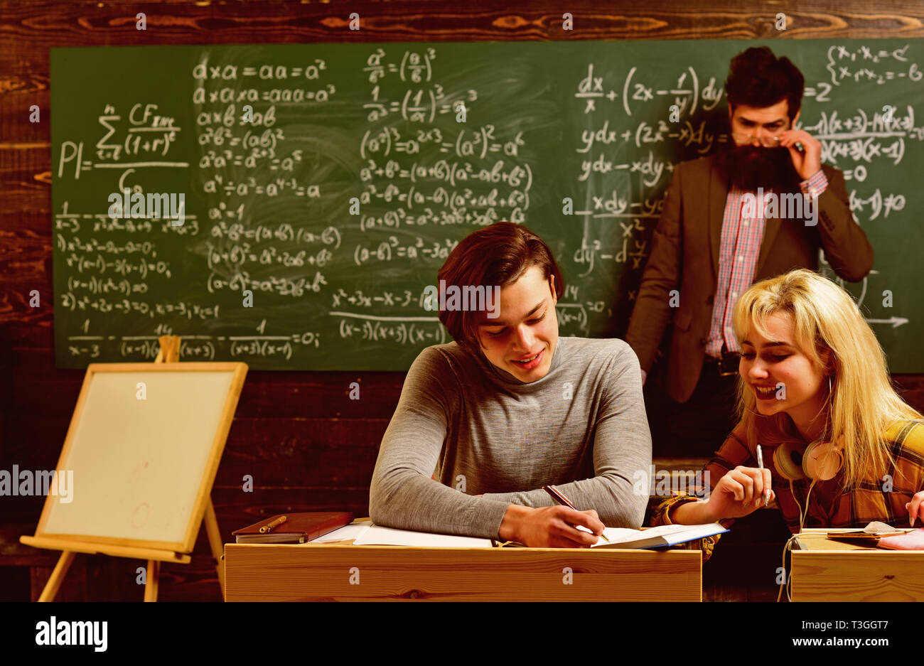 Student writing composition for annual exams preparation. Students ...