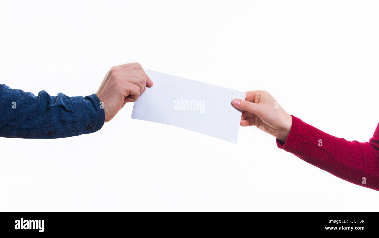 Transfer of correspondence between people.Man hand passes a white ...