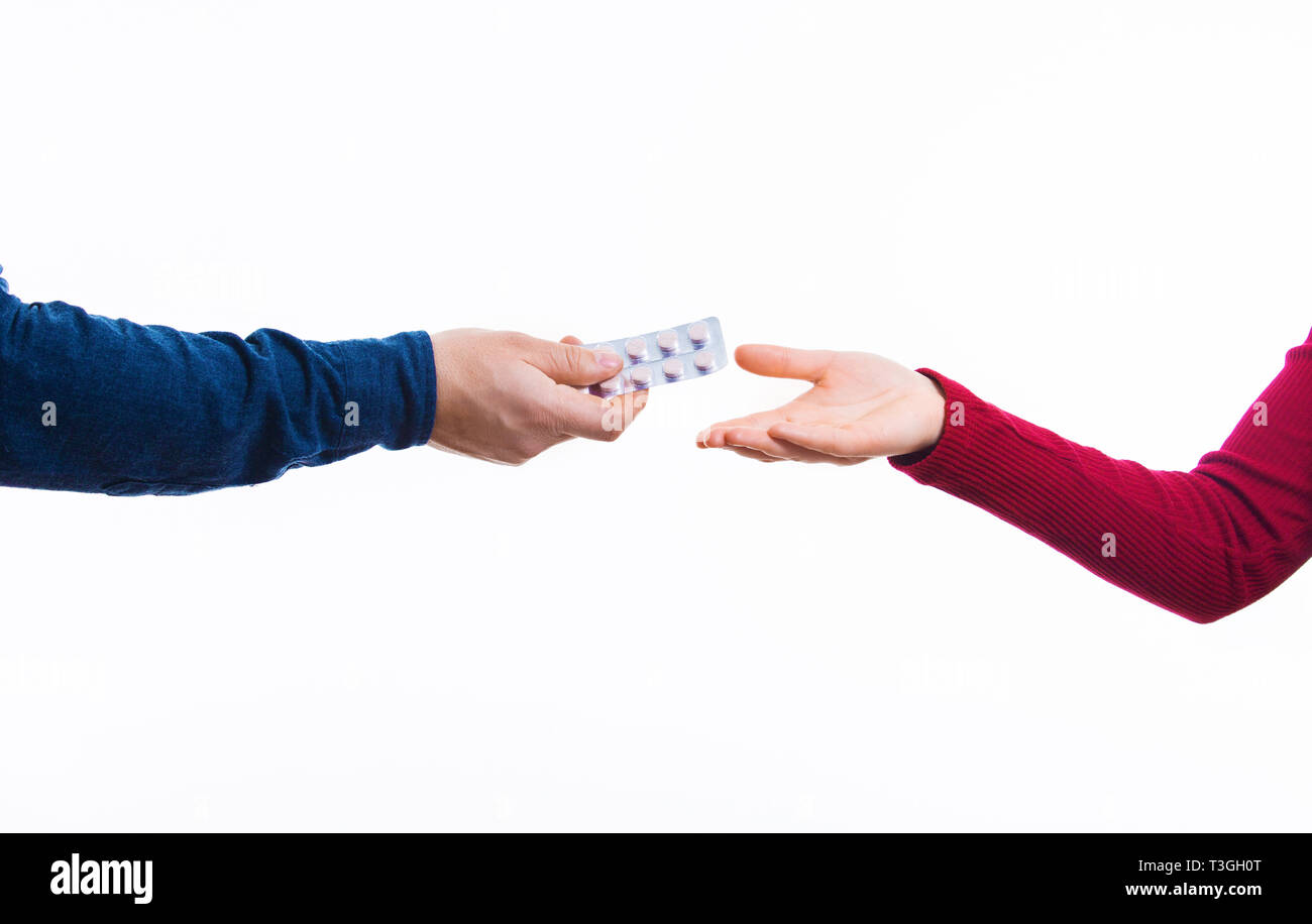 Hand giving pills over white background. Medicine pharmacy concept ...