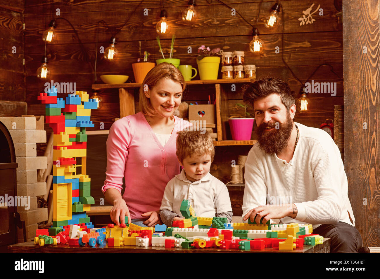 Team concept. Family team build structure with toy bricks. Team work ... Team concept. Family team build structure with toy bricks. Team work ...