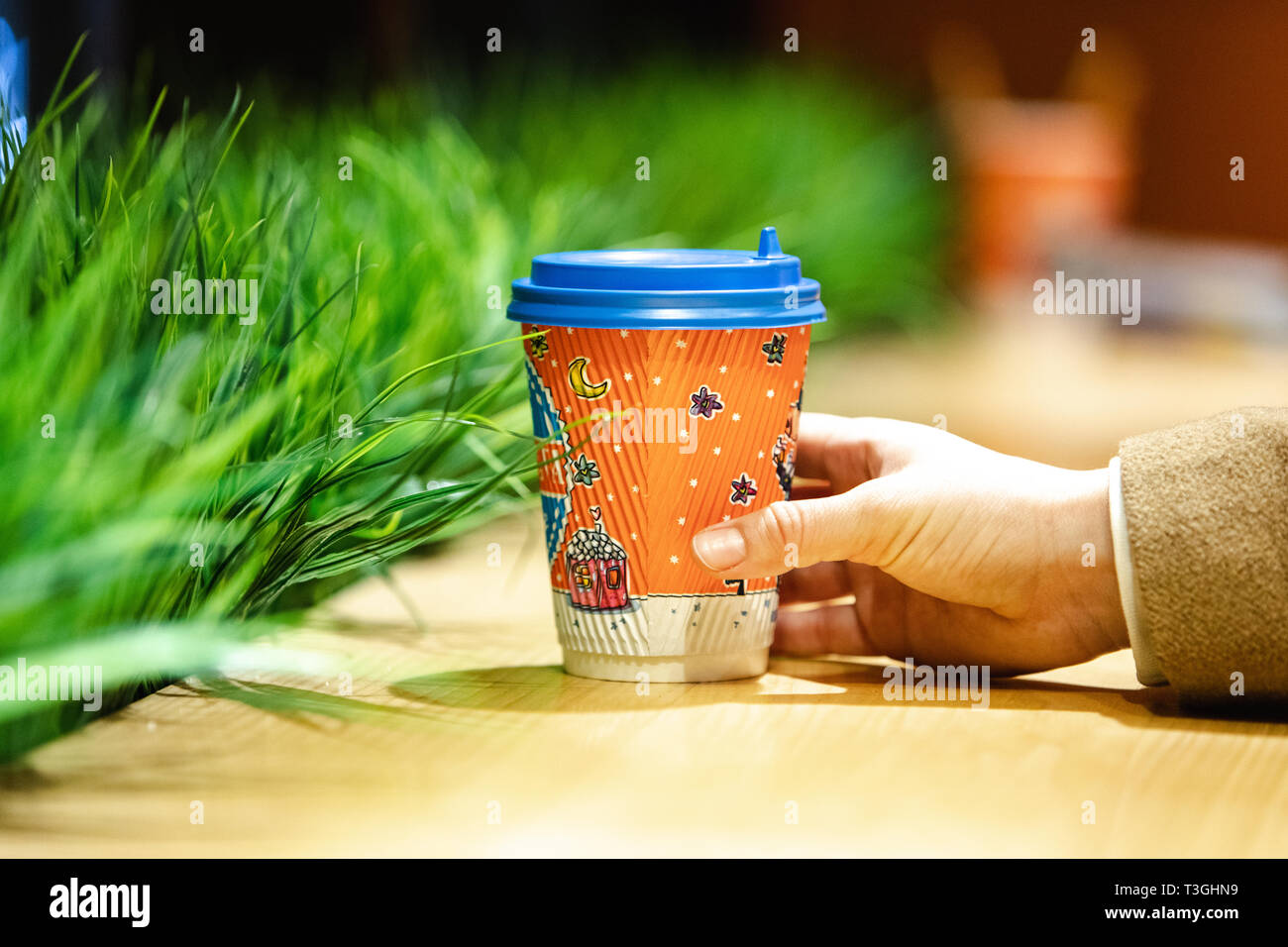 Close up hand taking disposable hi-res stock photography and images - Alamy