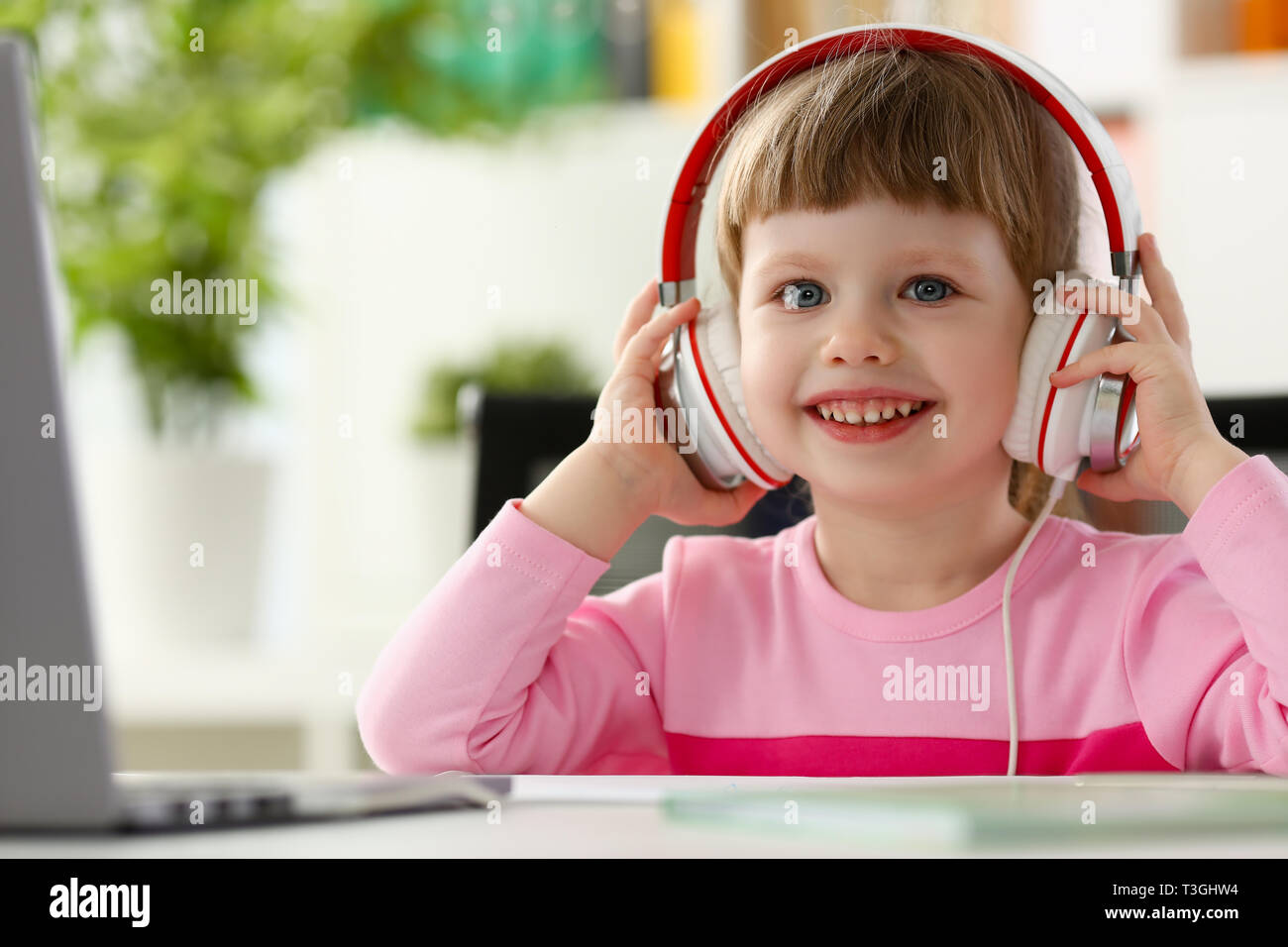 Cute adorable girl wearing headphones hi-res stock photography and ...