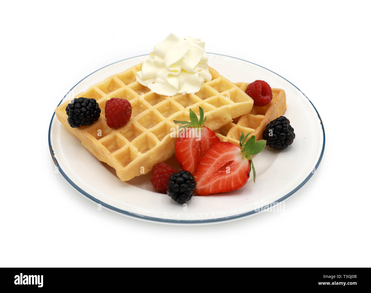 fresh belgian waffles topped with strawberries, fruits and berries and ...