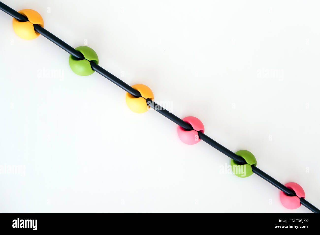 Yellow, Green and Pink the Colorful wall stick wire clip Stock Photo ...