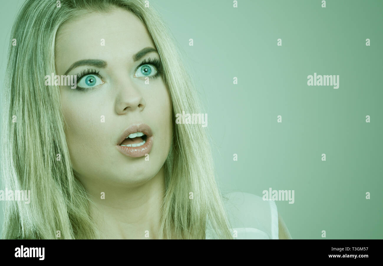 Emotional facial expression wide eyed woman surprised girl open mouth ...