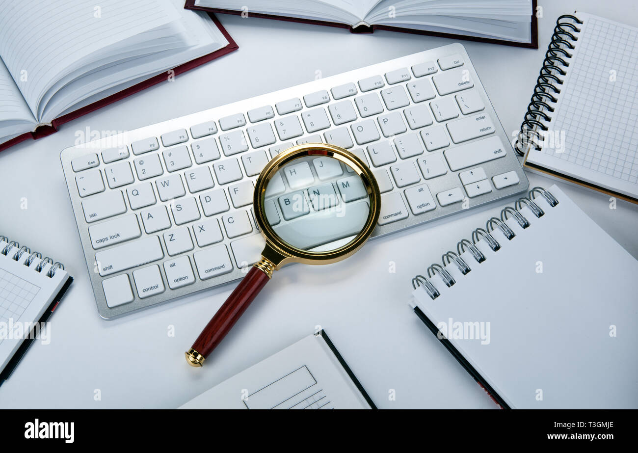 magnifying glass on the pc keyboard search technology concept Stock ...