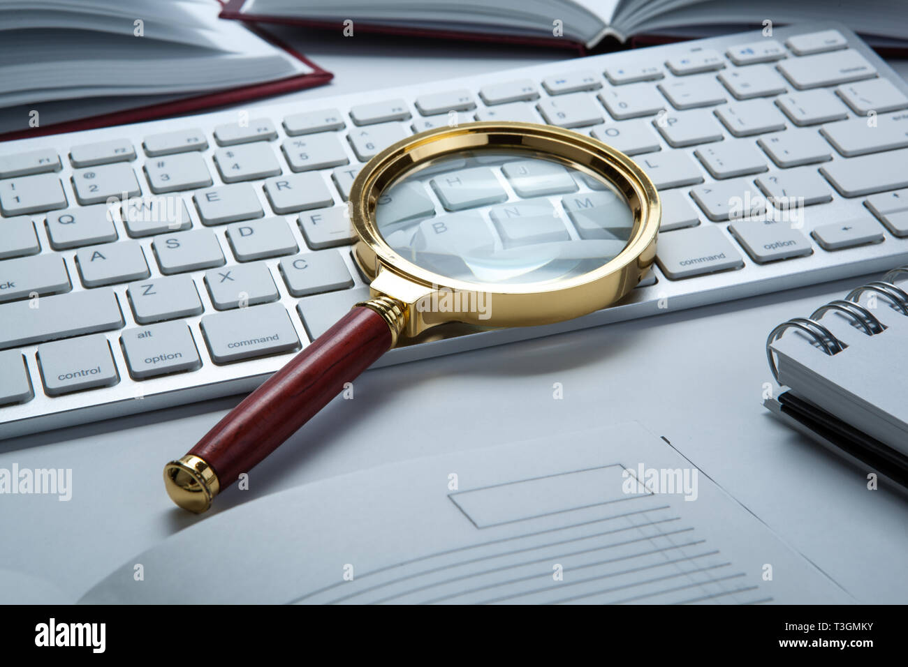 magnifying glass on the pc keyboard search technology concept Stock ...