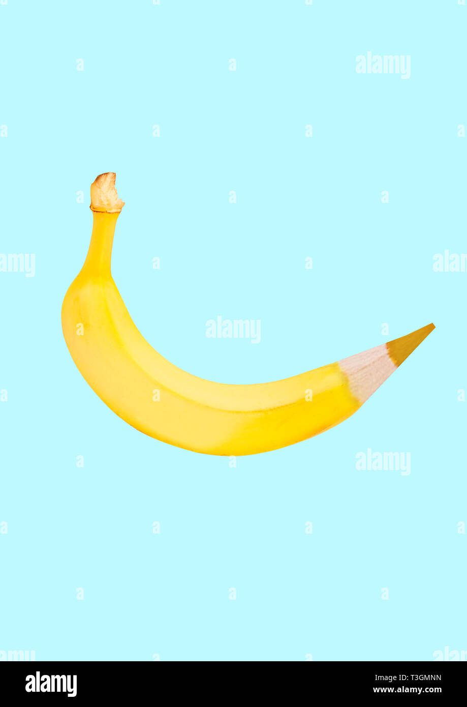 Natural drawing. An alternative yellow pencil as a banana against blue ...