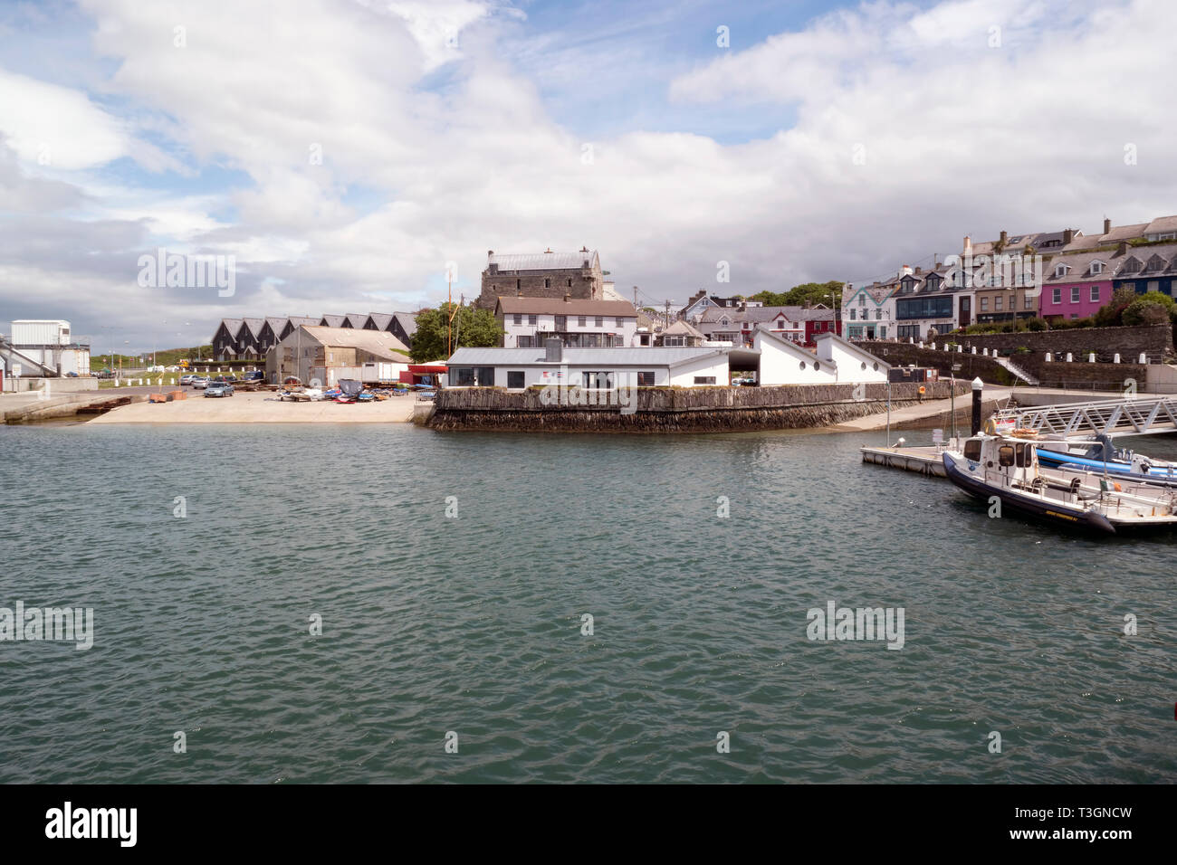 Baltimore harbour in County Cork with a castle on the top of a hill ...