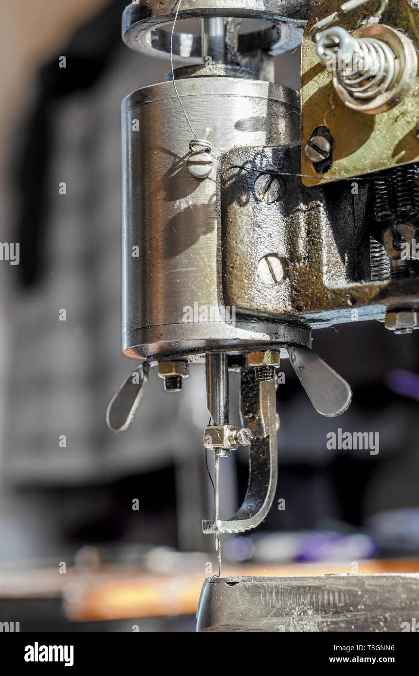 Vintage sewing machine, needle, thread. The shoemaker's workshop Stock ...