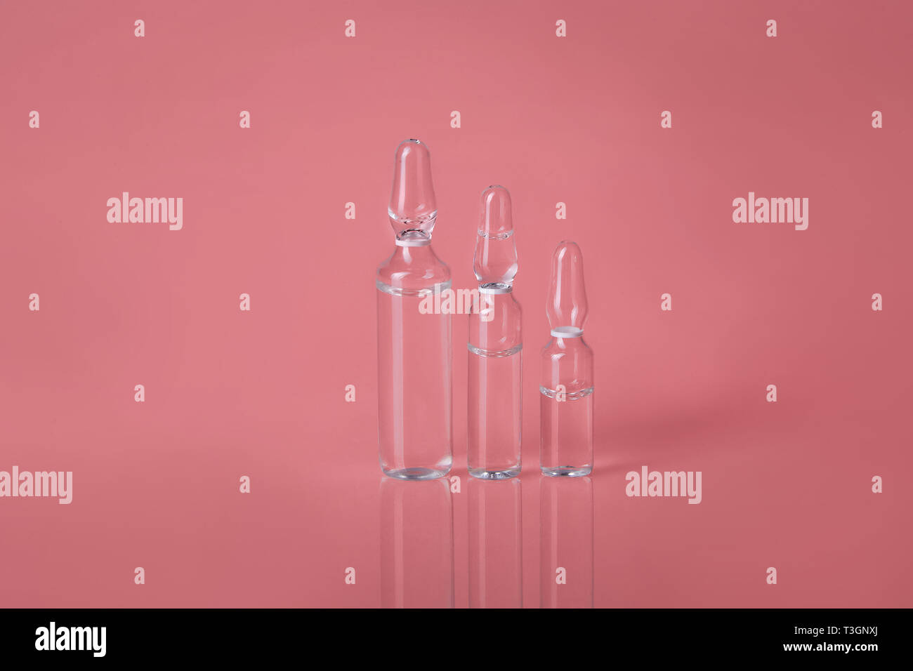 Raw of ampoules with liquid for injection. Break-seal glass ampules ...