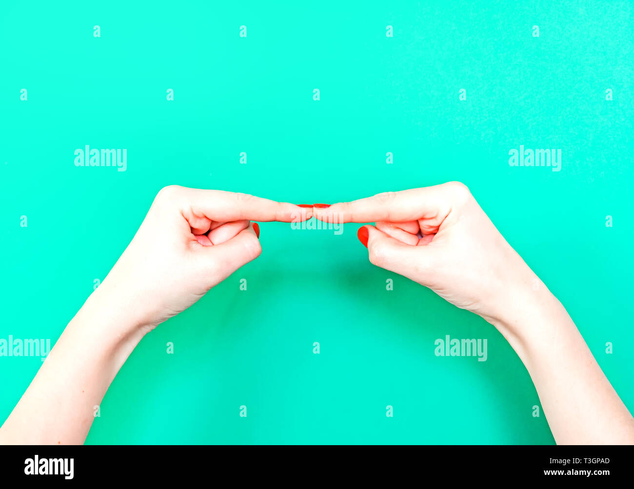 Break time hand gesture on isolated turquoise green color background ...